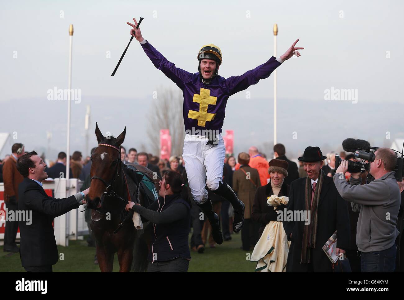 Robbie McNamara jumps off Spring Heeled as he celebrates winning the ...