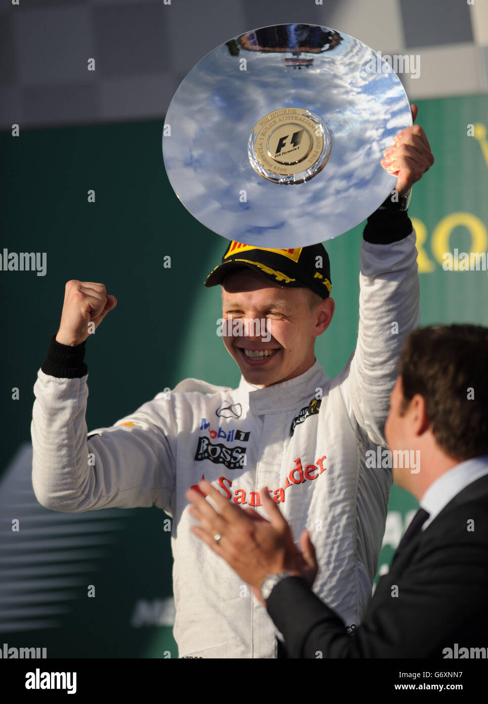 Denmark's Kevin Magnussen of McLaren Mercedes celebrate his third place ...