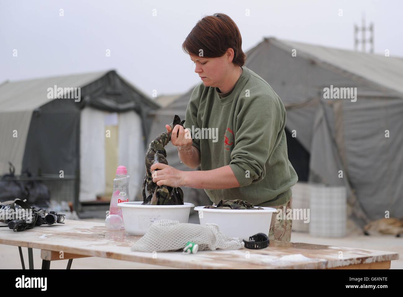 22/02/14 Corporal Samantha Rodway of 220 Signal Squadron hand washing ...