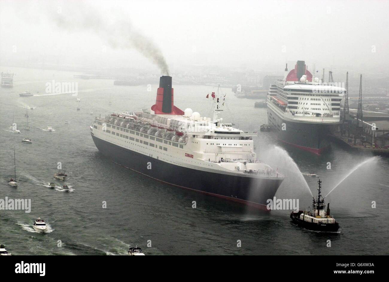 The QE2 passing the QM2 at Southampton. The end of an era in cruising ...