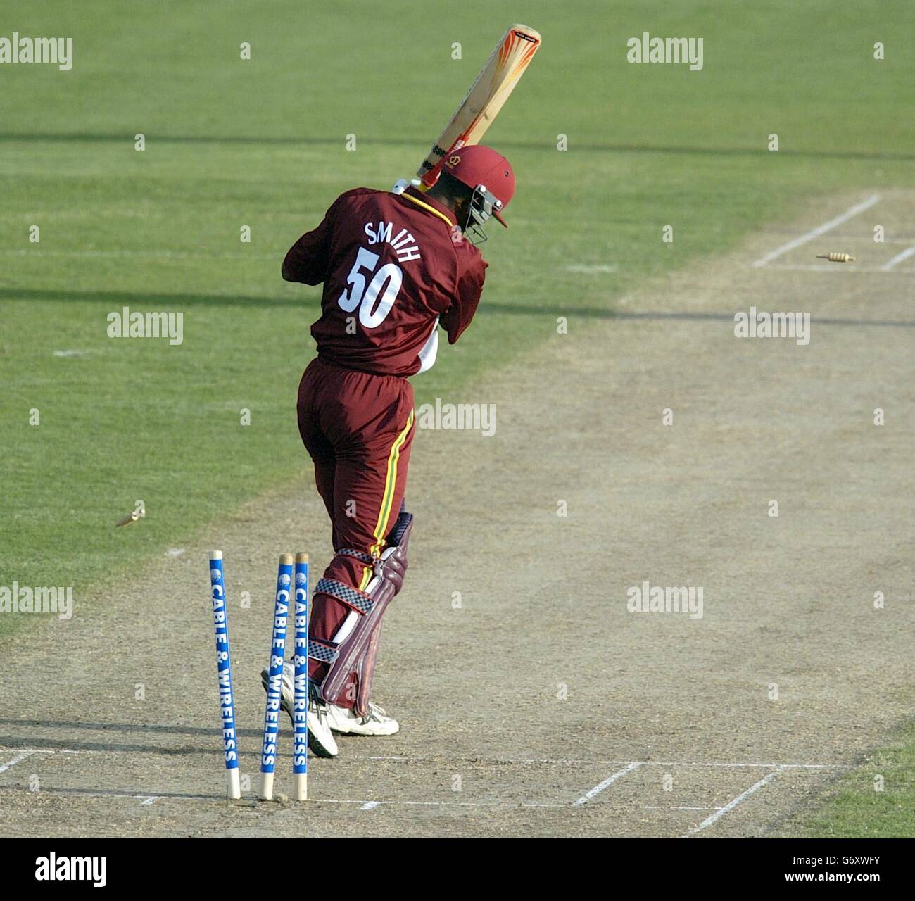 West Indian batsmsn Dwayne Smith's wicket is broken by the bowling of ...