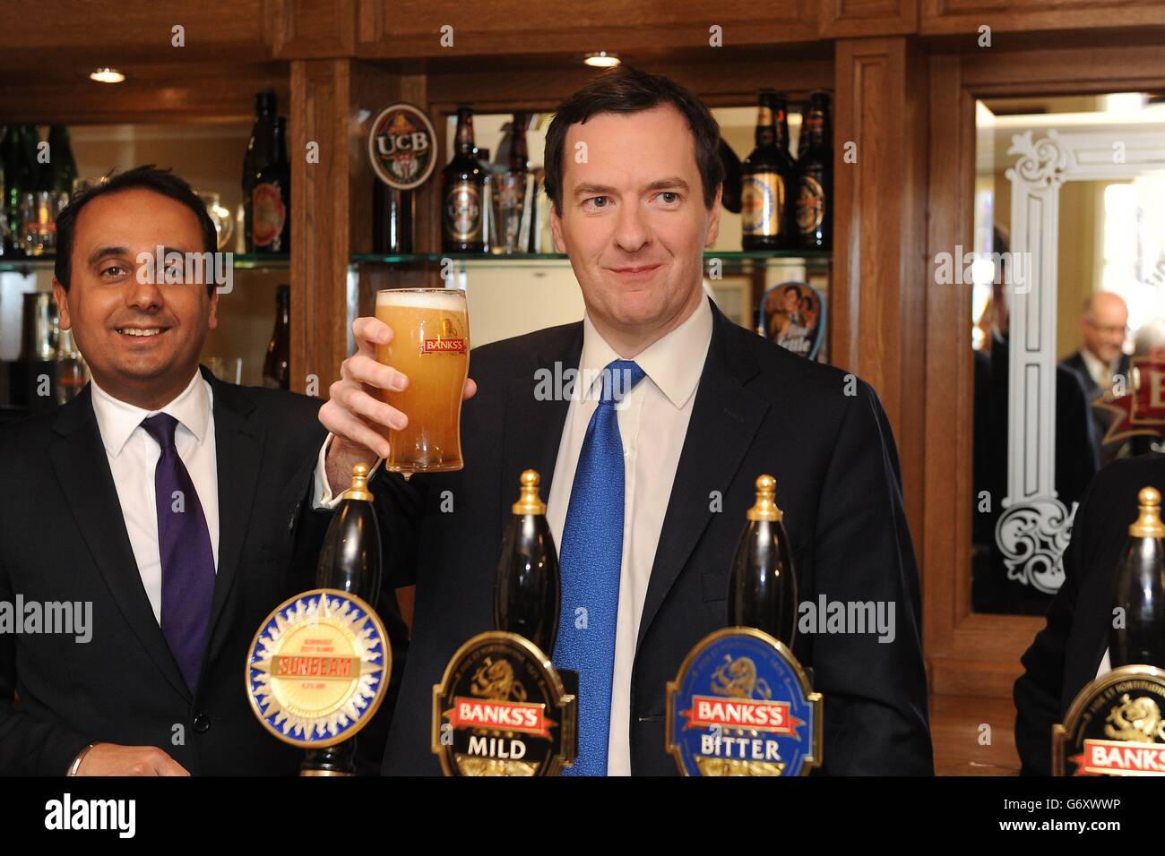 Chancellor George Osborne with a pint of Sunbeam ale alongside ...