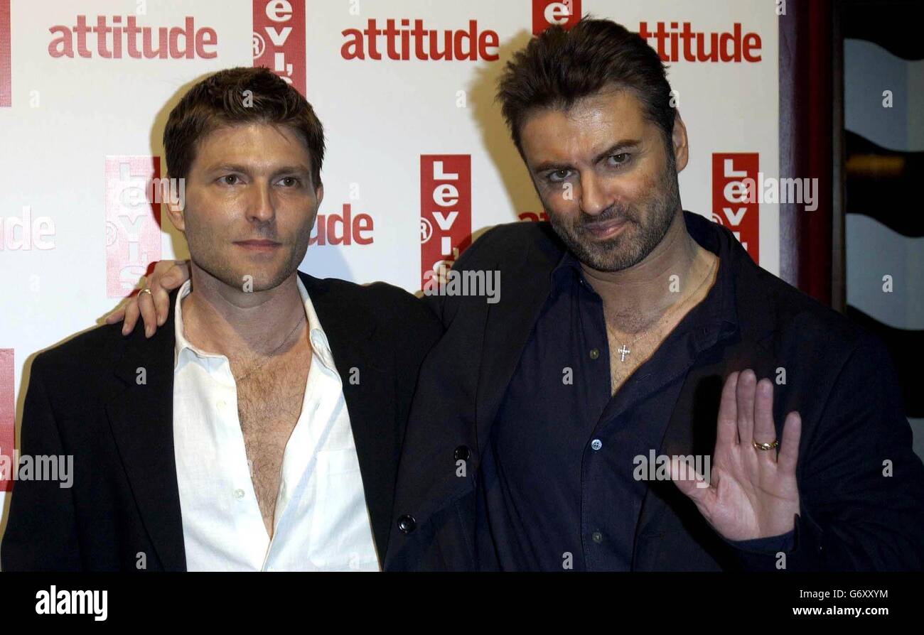 Singer George Michael (right) and his partner Kenny Goss arrive for ...
