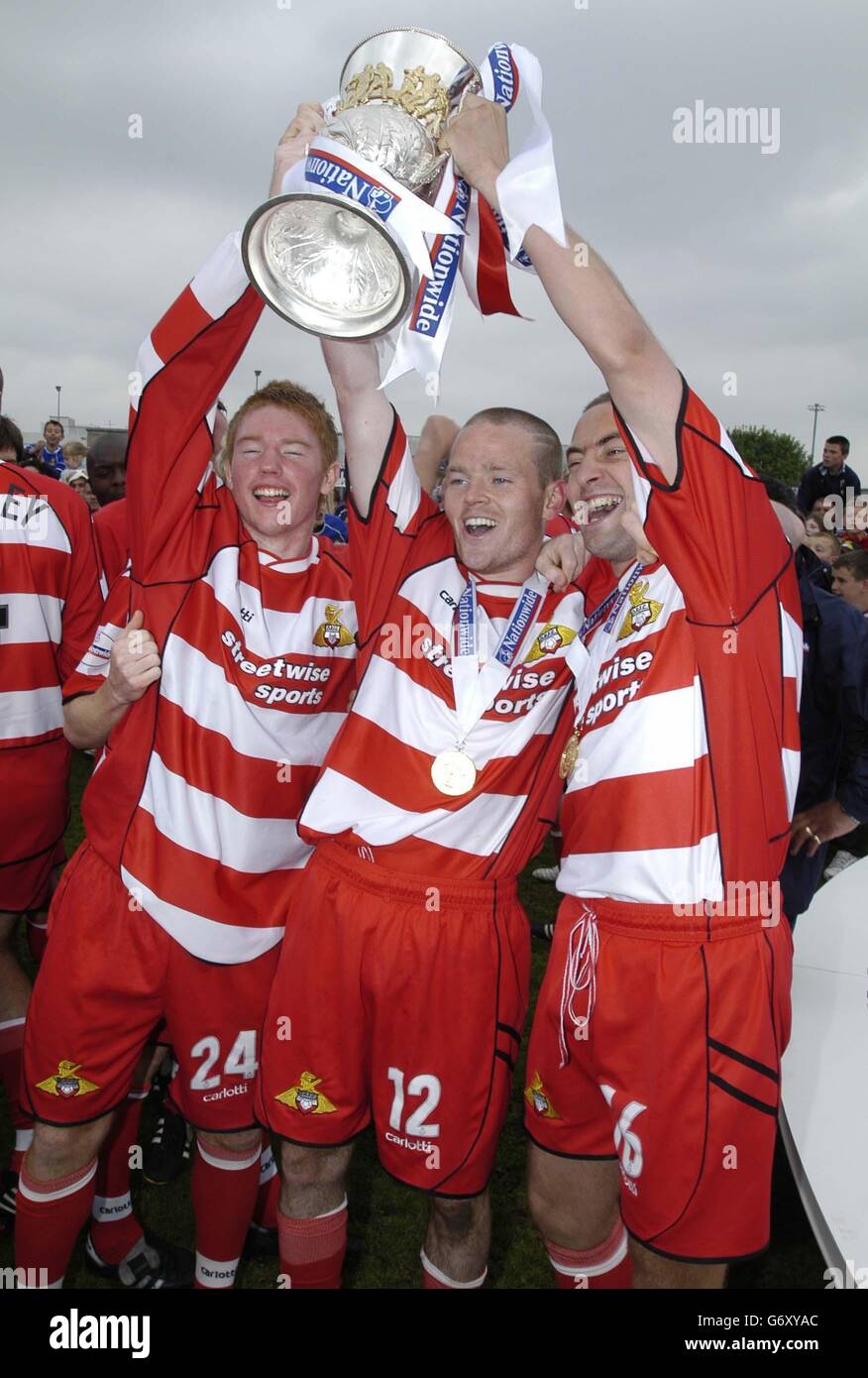 Doncaster Rovers celebrate with the Thrid Division Championship trophy ...