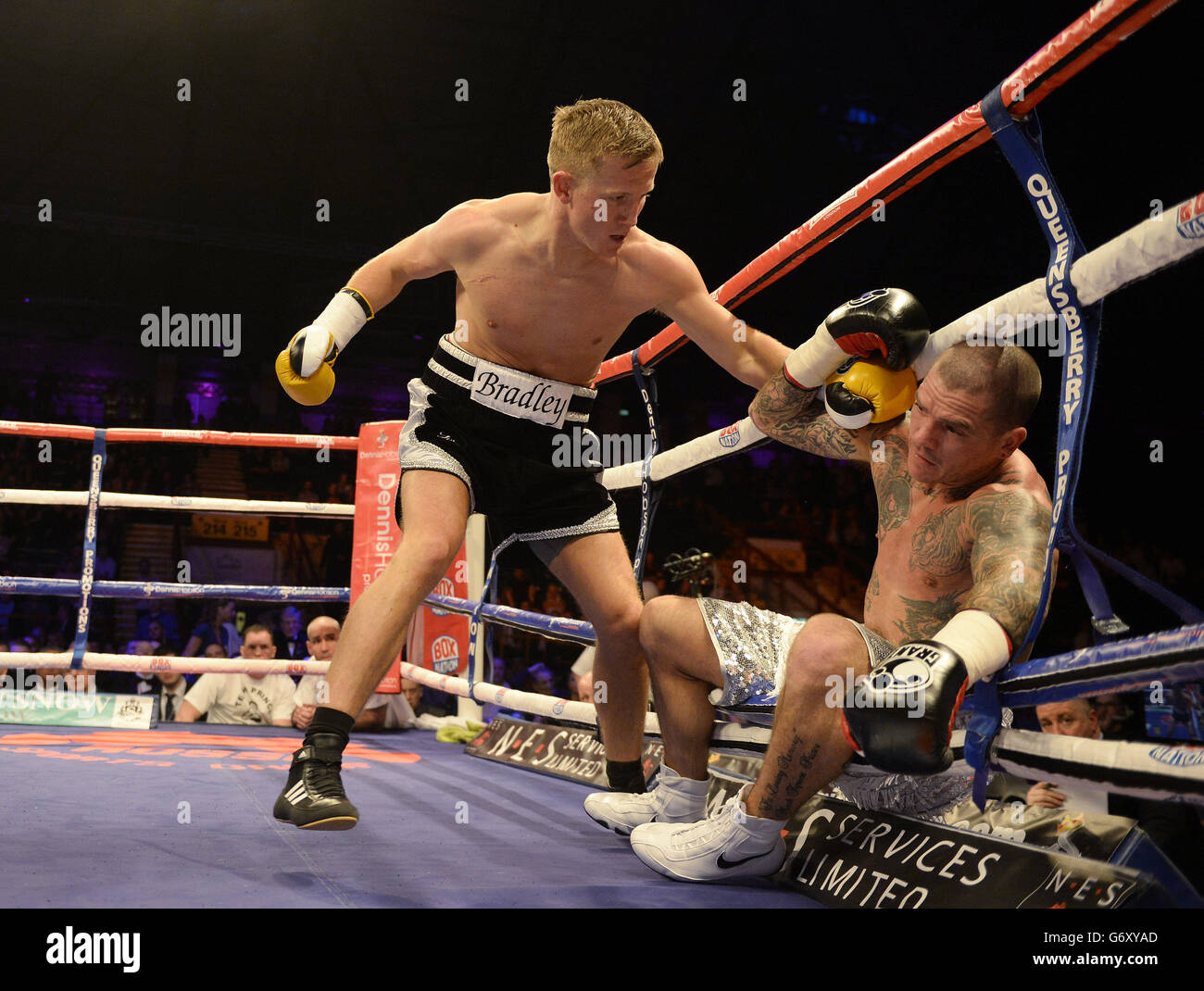 Bradley Saunders (left) knocks down Mitch Prince in the first round ...
