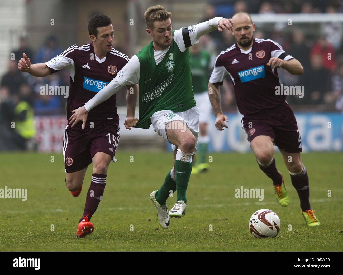 Hearts' Jason Holt and Hibernian's Danny Handling (right) battle for ...