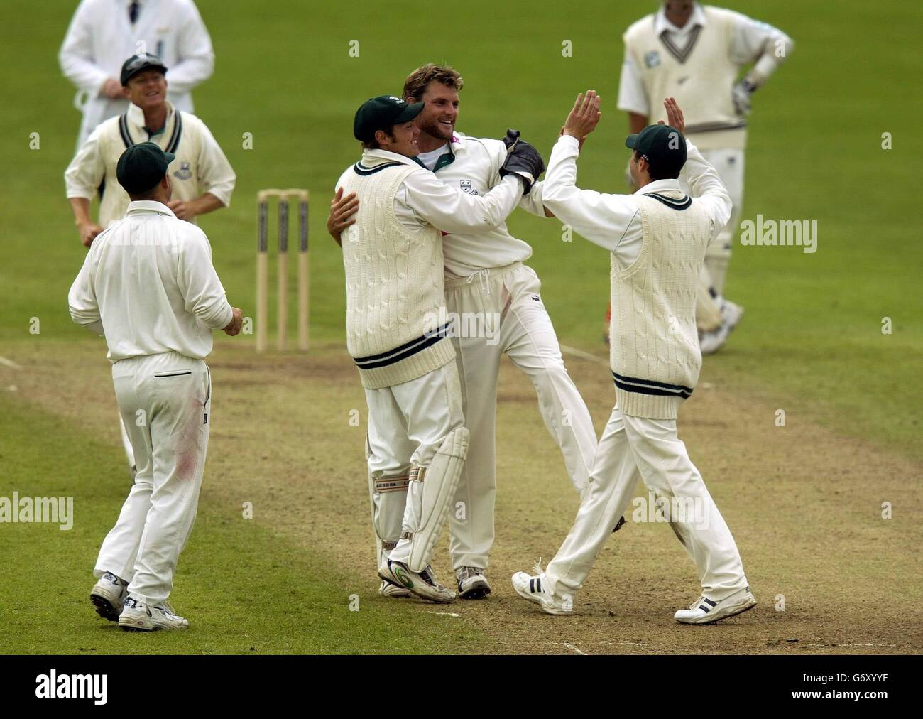 Worcestershire's Mark Harrity (centre) is congratulated by wicketkeeper ...