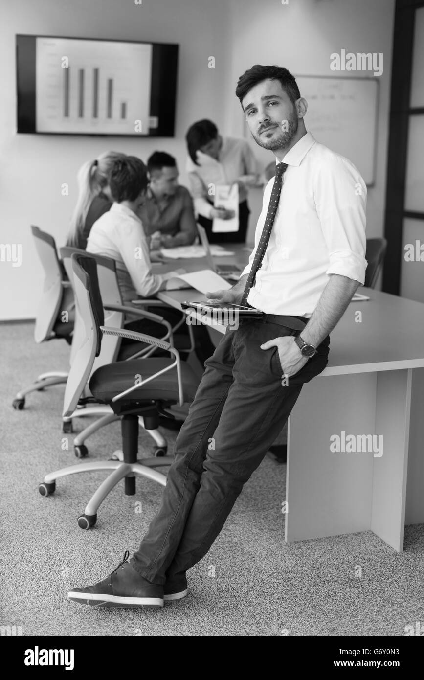Young man using computer in office Black and White Stock Photos ...
