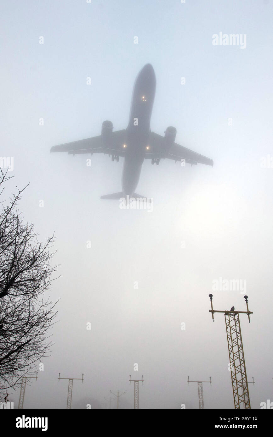 Planes land in fog at Heathrow Airport, west London, as heavy fog ...