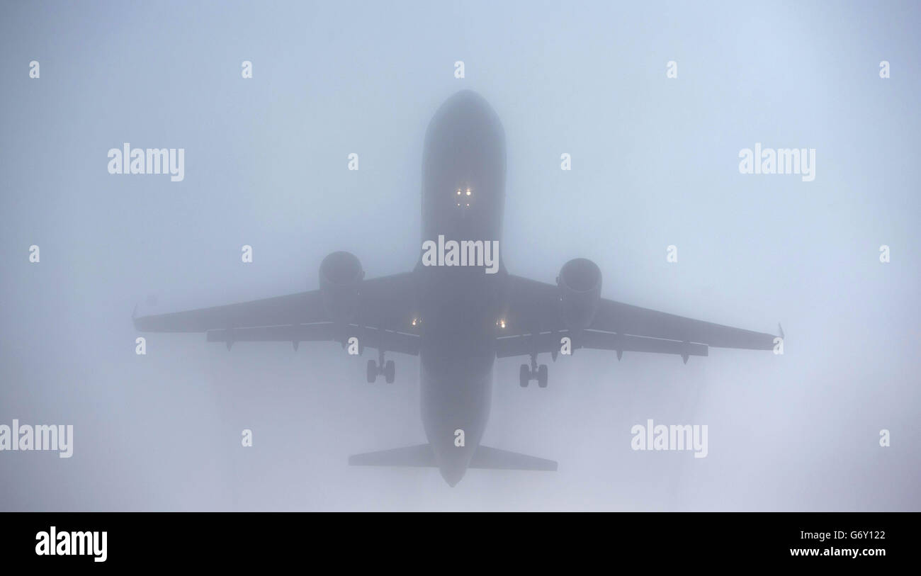 Planes land in fog at Heathrow Airport, west London, as heavy fog ...