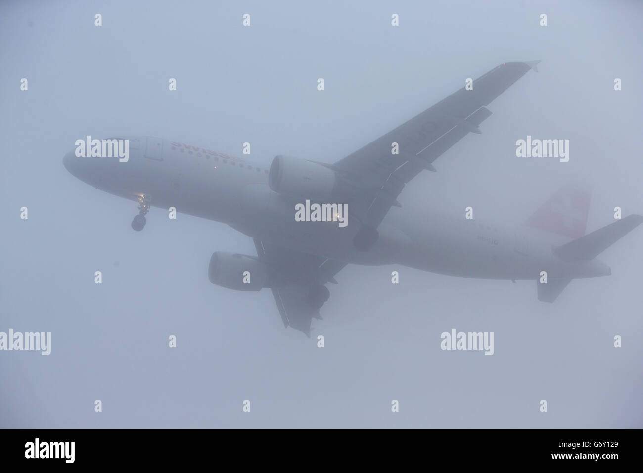 Spring weather April 1st. Planes land in fog at Heathrow Airport, west ...