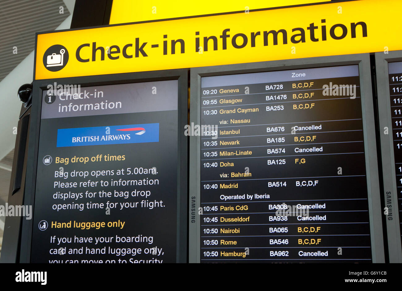 A check-in information board at Terminal 5 after the weather has led to ...