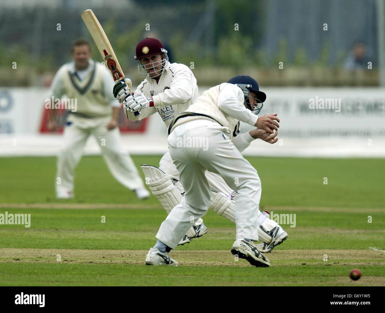 Northamptonshires tim roberts flicks the ball past gloucestershires tim ...