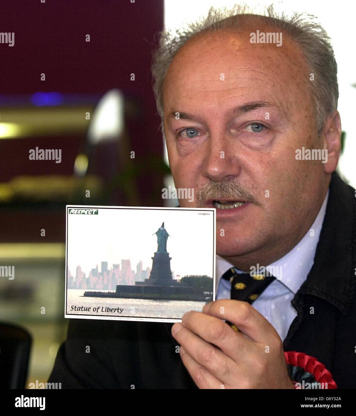 George Galloway MP Galloway holding a "Respect" party post card showing ...