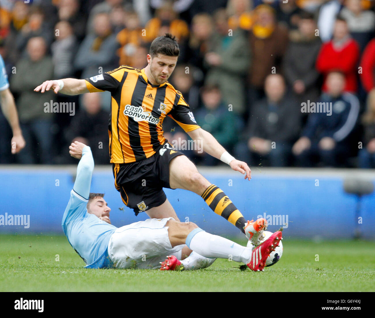 Hull's Shane Long (right) and Manchester City's Javier Garcia challenge ...