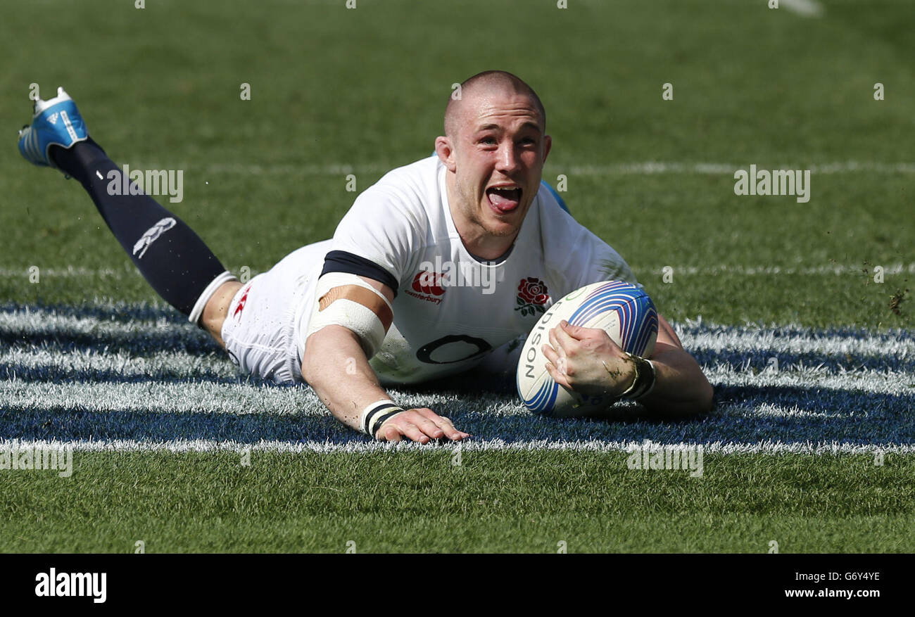 Mike Brown celebrates scoring his second and England's third try during ...