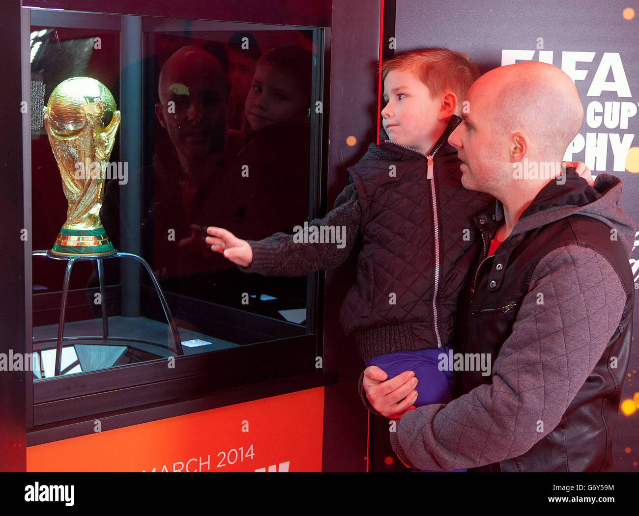 Football supporterJack Robson (7) and his dad Kevin Robson, from ...