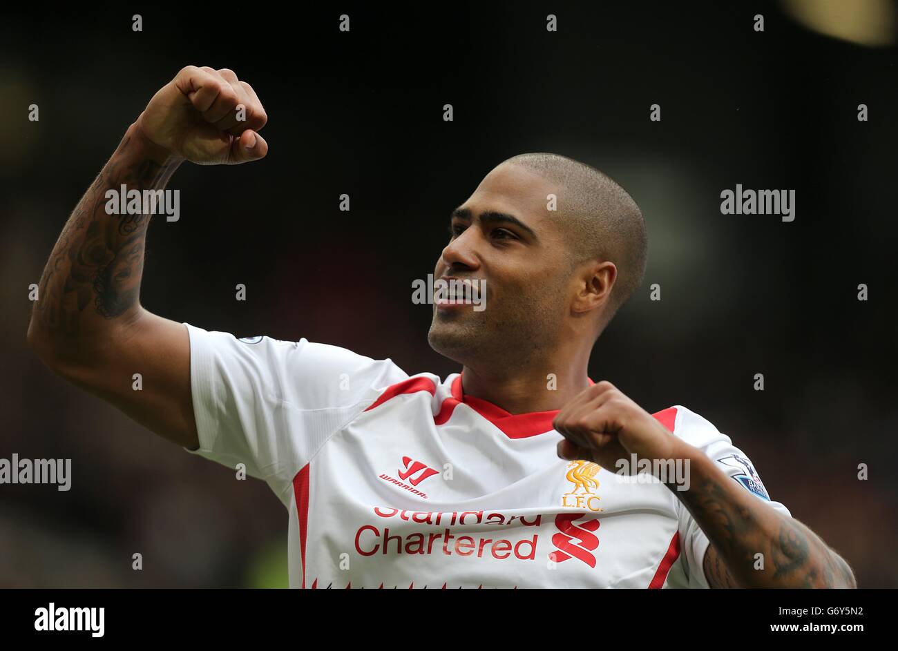 Liverpool's Glen Johnson celebrates after his team-mate Steven Gerrard ...