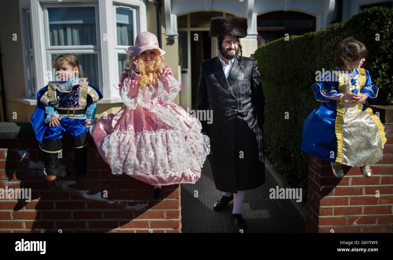 Orthodox Jewish children celebrate the festival of Purim in the streets ...