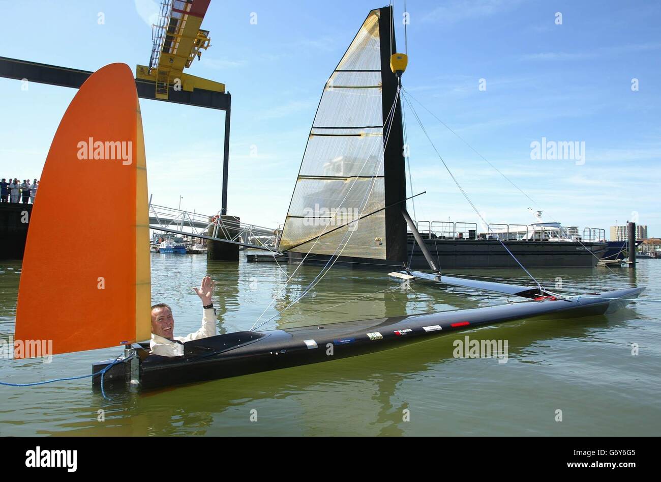 Sailor Paul Larson waves from the cock-pit of his Sail Rocket at its ...