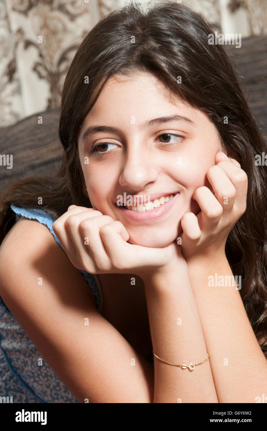 Happy girl looking away smiling Stock Photo - Alamy