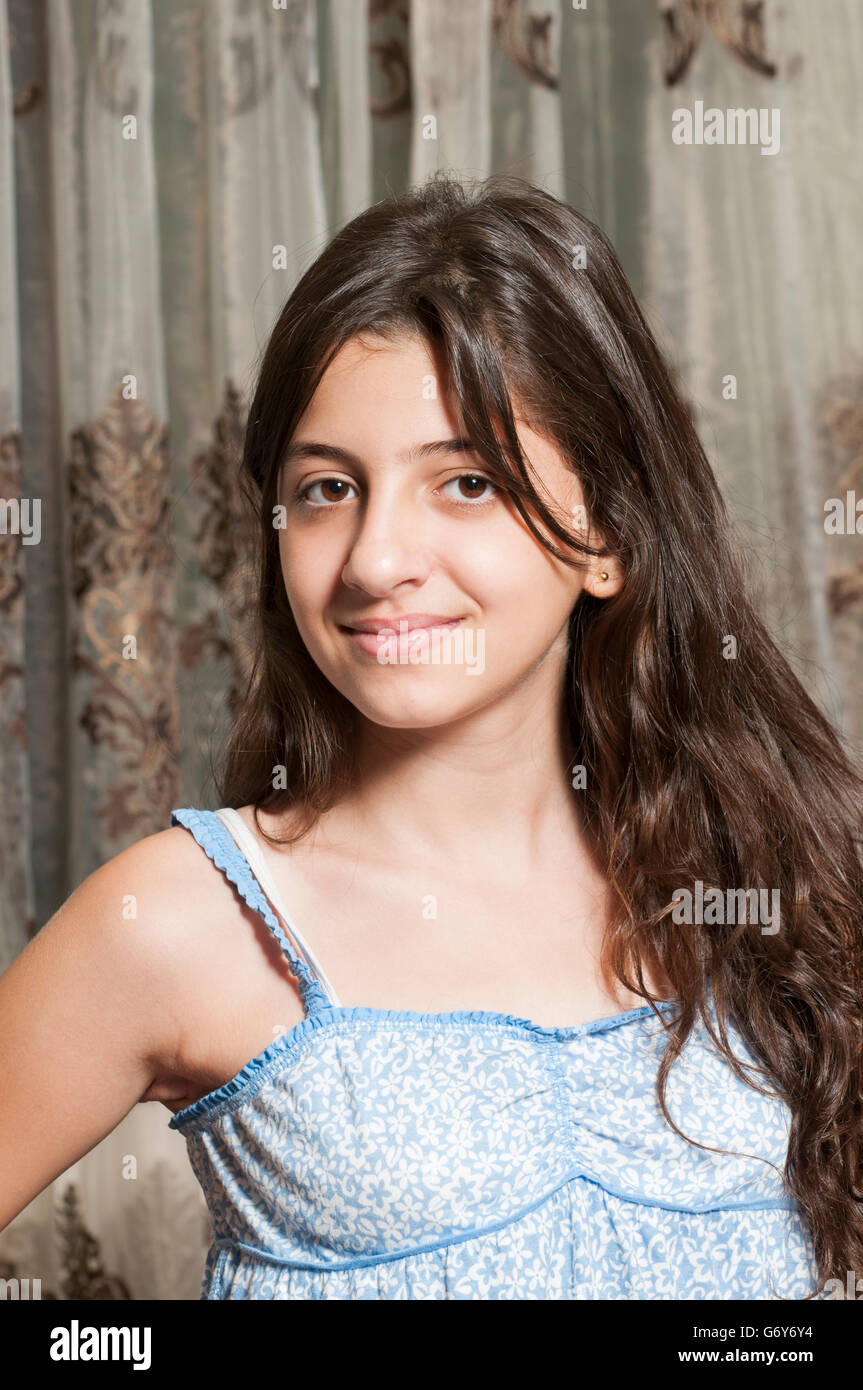 Beautiful girl smiling indoors Stock Photo - Alamy