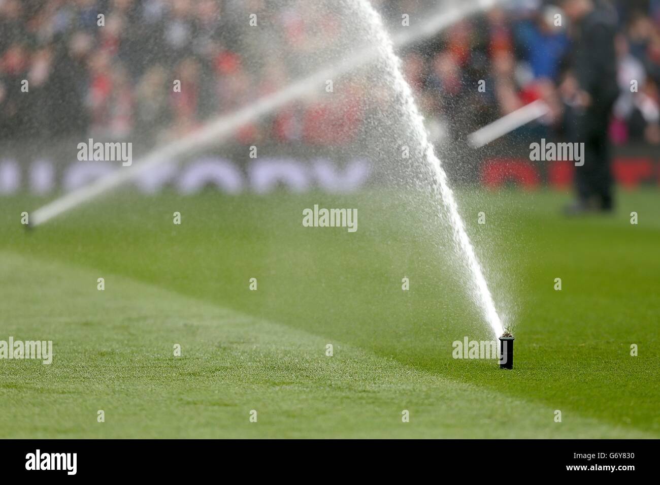 Sprinklers water pitch before game hi-res stock photography and images ...