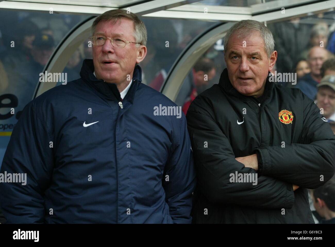 Manchester United manager Sir Alex Ferguson (left) with his assistant ...
