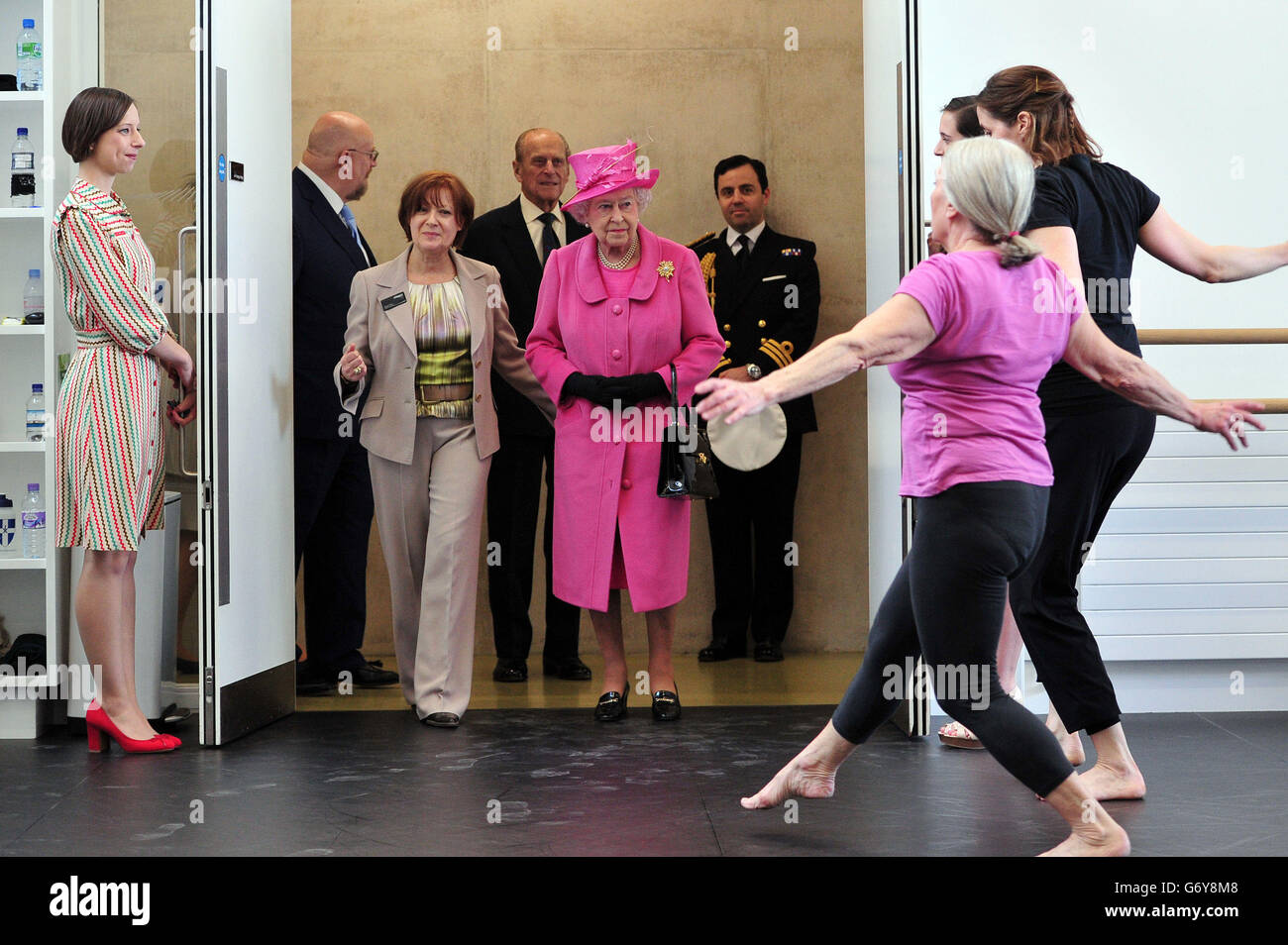 Queen Elizabeth II and Duke of Edinburgh watch dancers during a visit ...