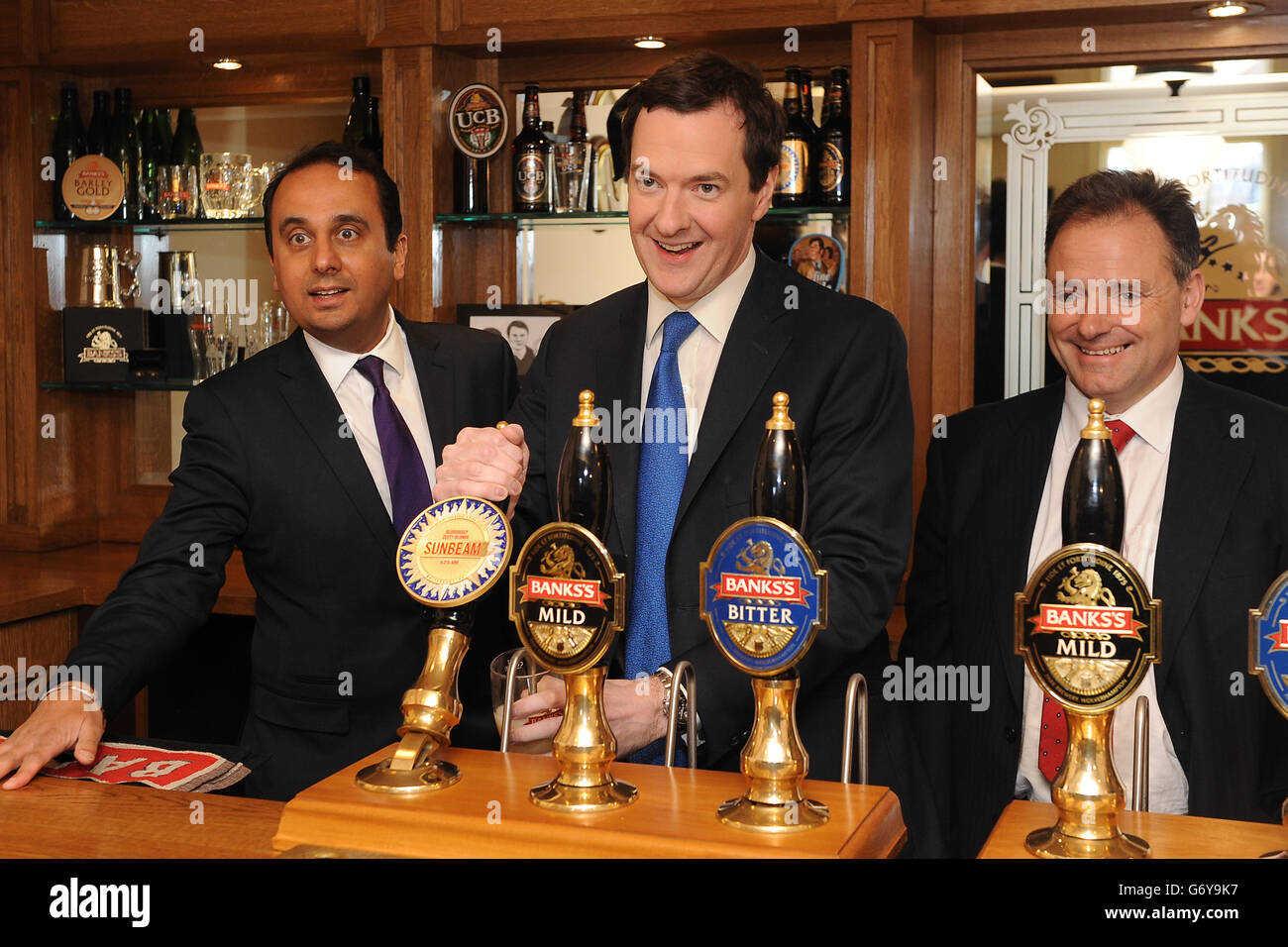 Chancellor George Osborne pulls a pint of Sunbeam ale alongside ...