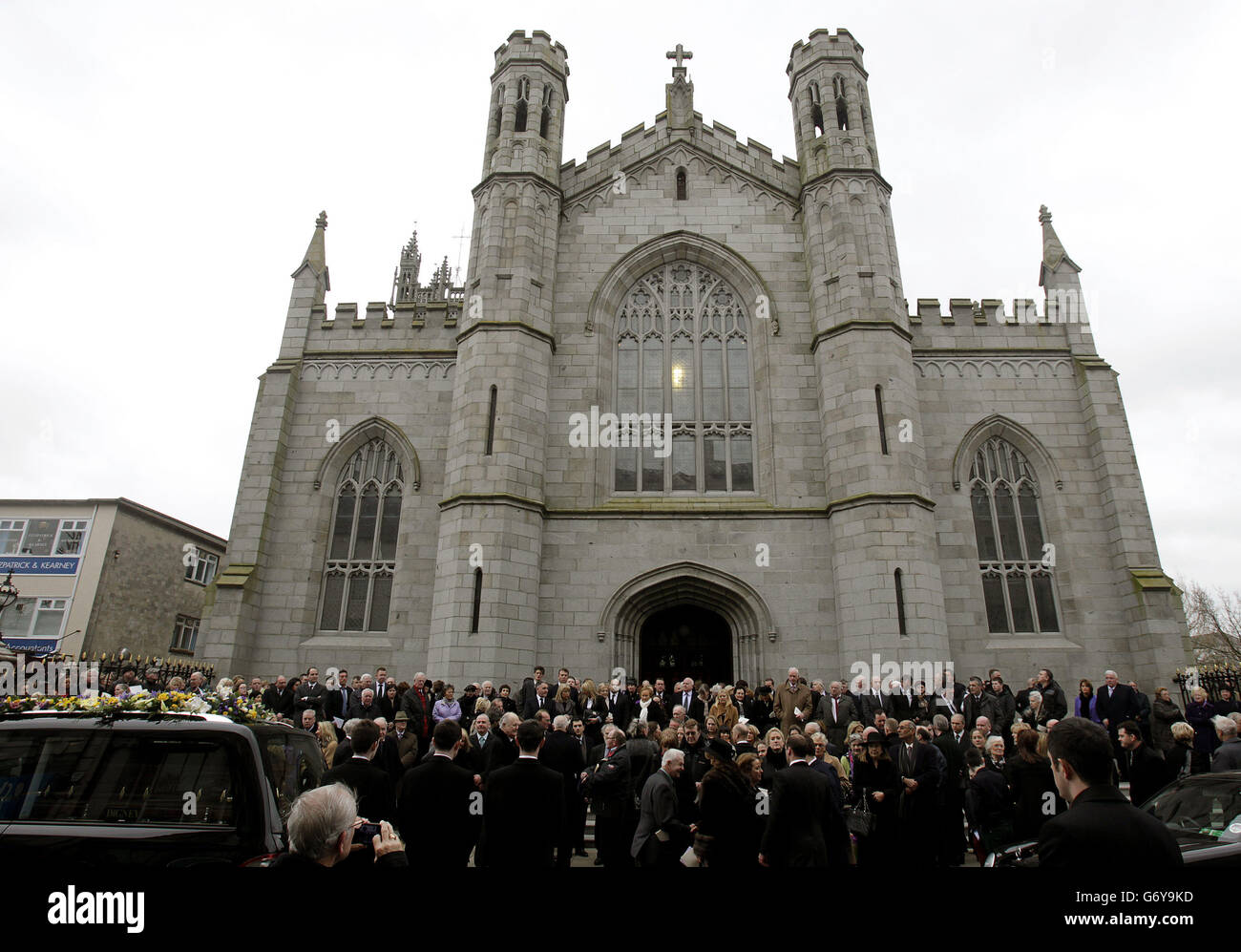 Mourners gather outside Newry Cathedral, Co. Down, following the ...