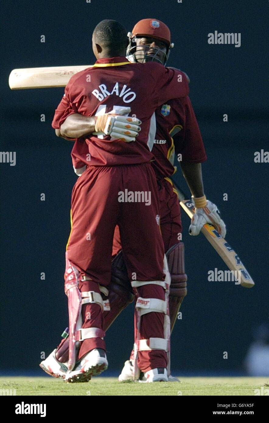 West Indian batsman Ridley Jacobs hugs Dwayne Bravo after beating ...
