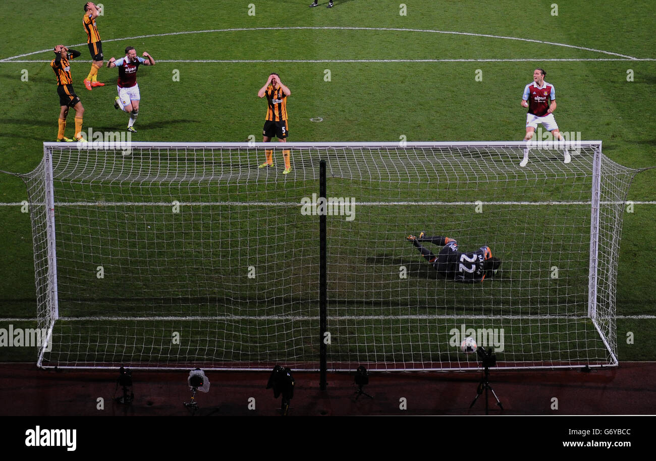 Hull's James Chester (centre) reacts after scoring an own goal during ...
