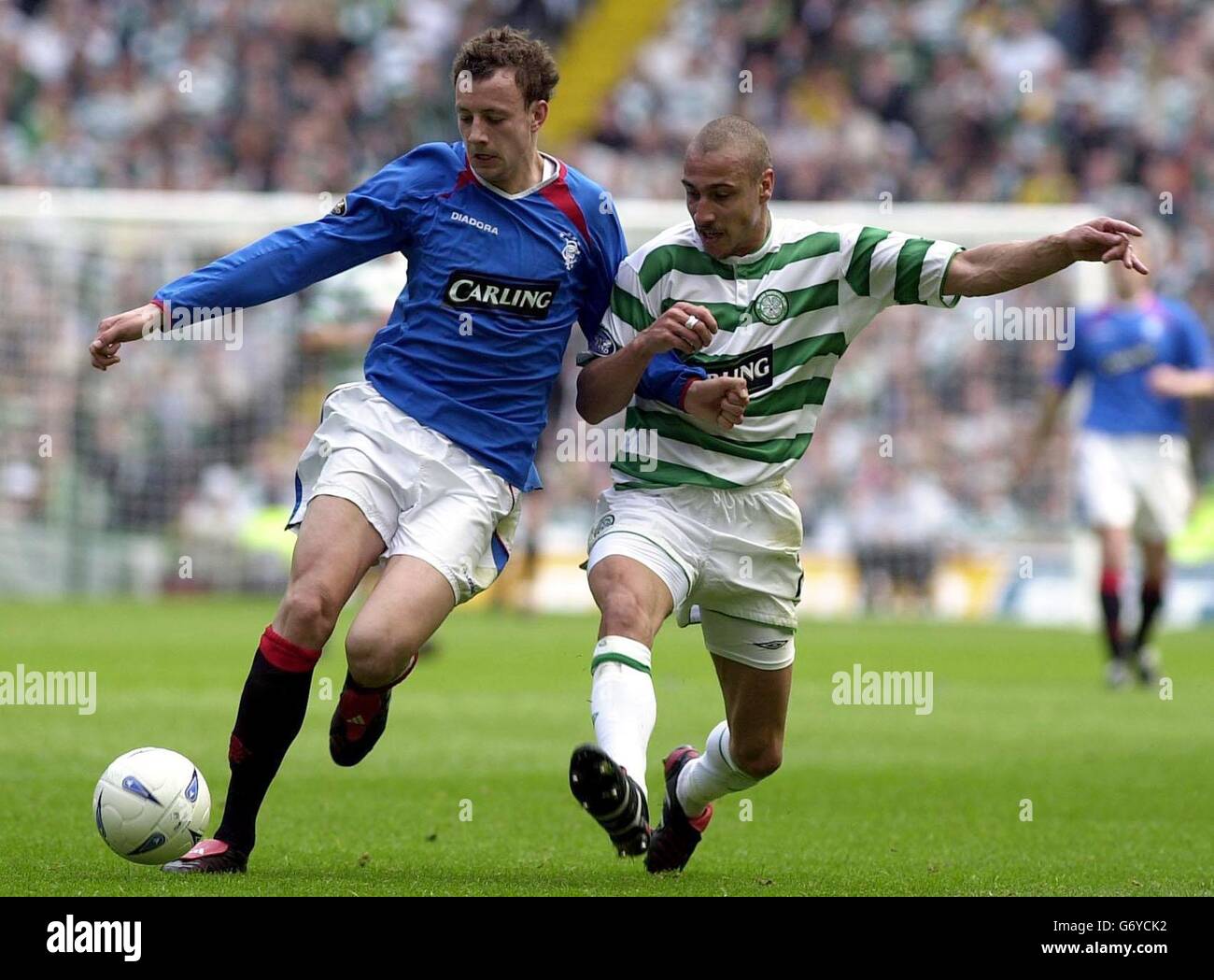 Celtic's Henrik Larsson (right) in action with Alan Hutton of Rangers ...
