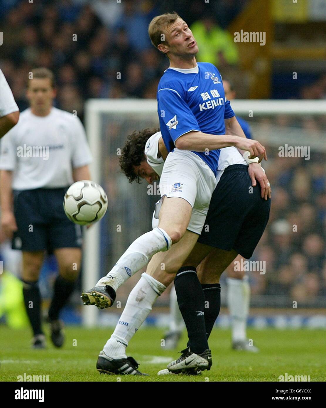 Everton's Duncan Ferguson (foreground) battles with Bolton Wanderers ...