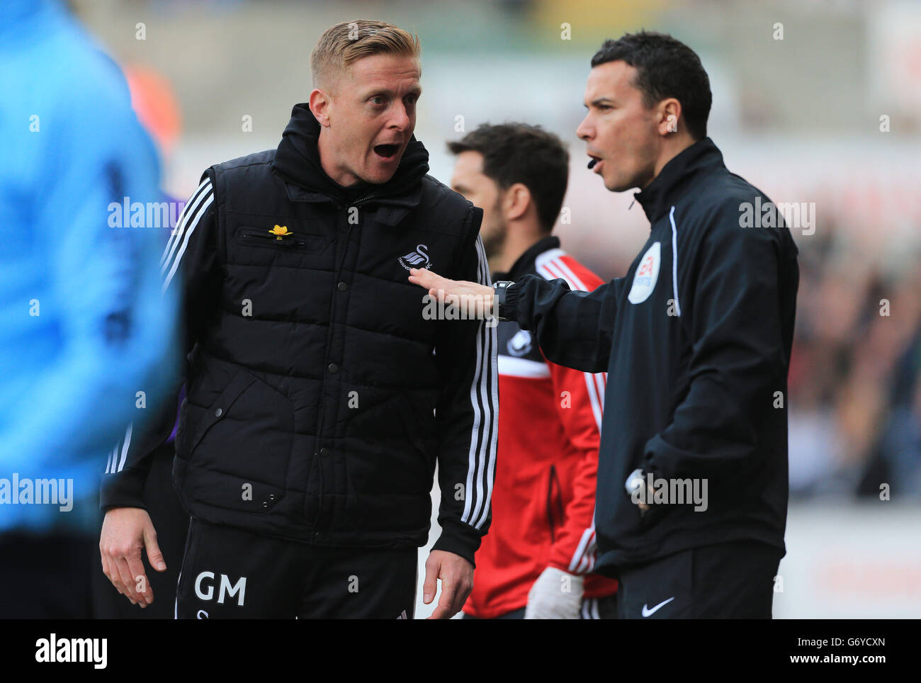 Swansea City manager Garry Monk exchanges words with 4th official Dean ...
