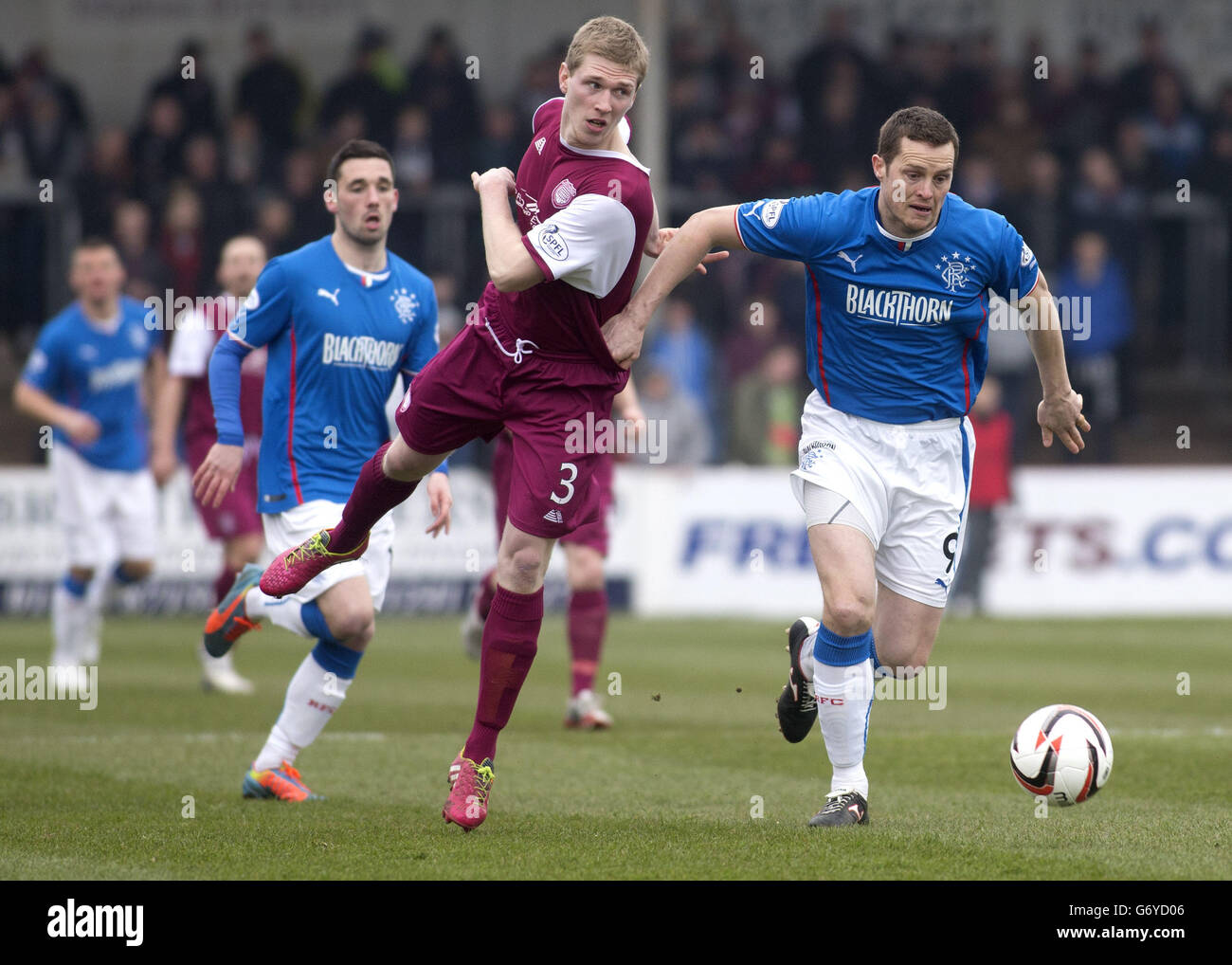 Rangers' Jon Daly and Arbroath's Colin Hamilton (left) battle for the ...