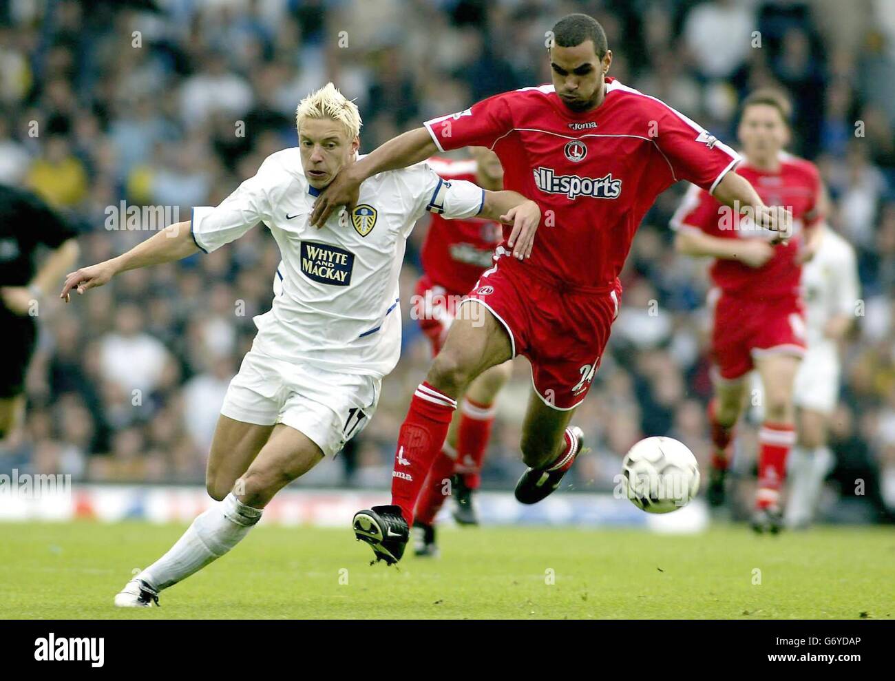 Leeds's Alan Smith is denied possesion by Charlton's Jonathan Fortune ...