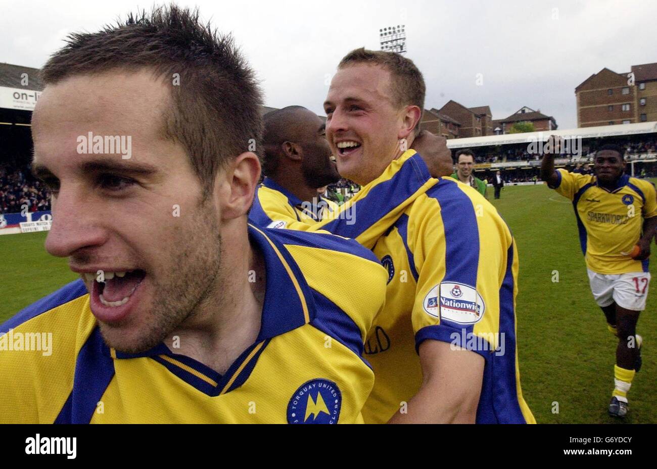 Torquay players celebrate automatic promotion to the second division ...