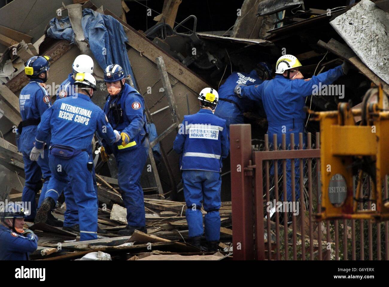 International Rescue Corps look around the rubble at the Stockline ...