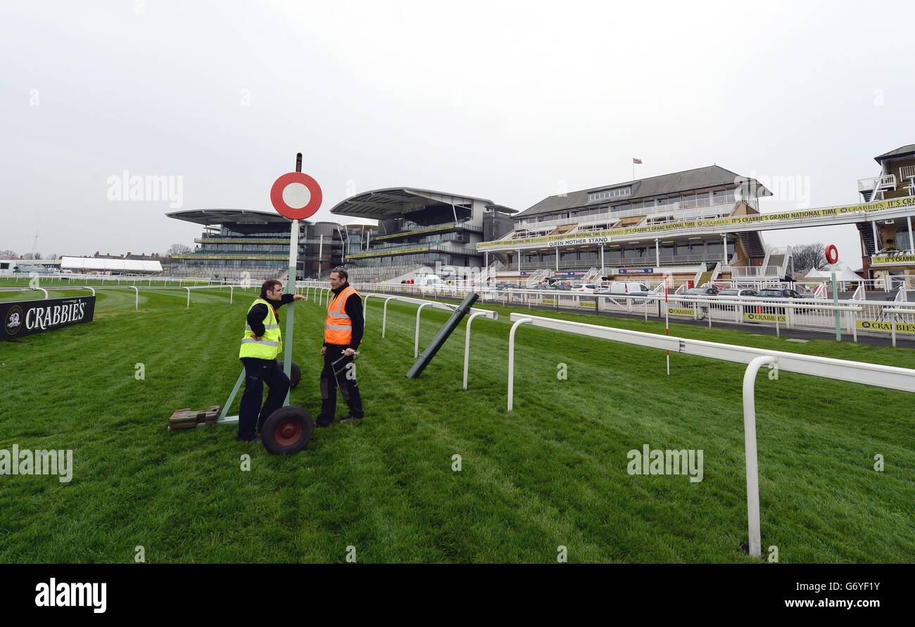 Course workers at the finish line of the Grand National course during a ...