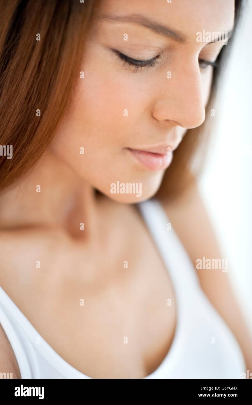 MODEL RELEASED. Young woman looking down, close up Stock Photo - Alamy