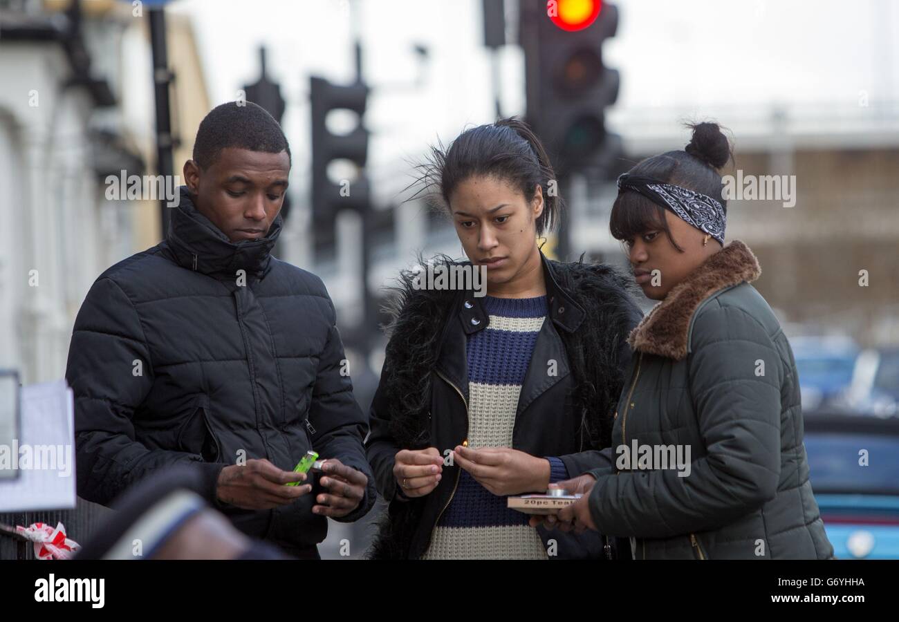 Young people light candles at the scene in Eastway, Hackney, east ...
