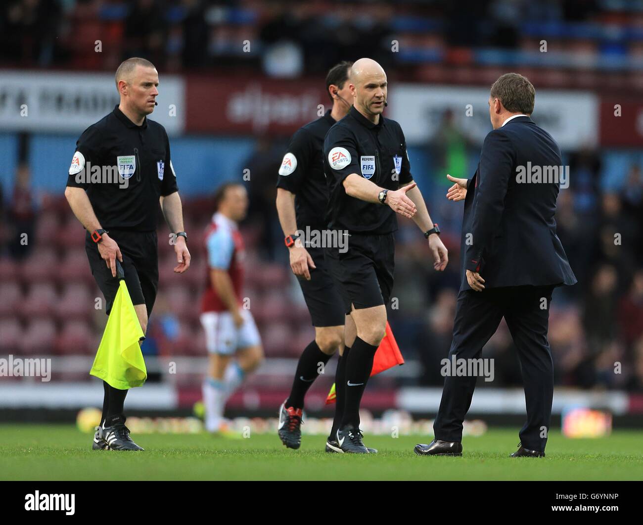 Match referee Anthony Taylor (centre) shakes hands with Brendan Rodgers ...