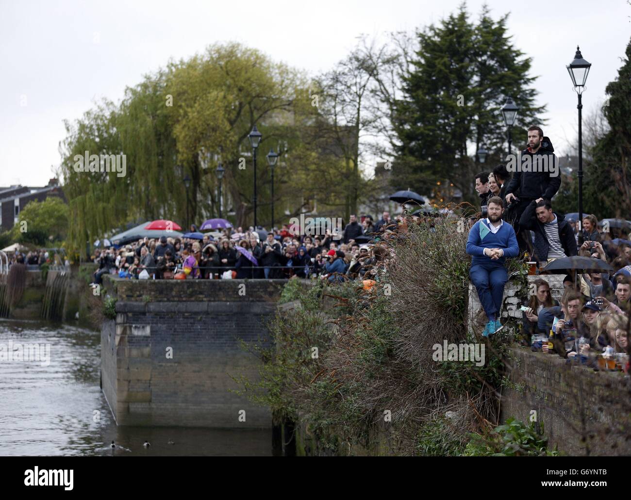 Spectators line the north bank of the River Thames near The Old Ship at ...
