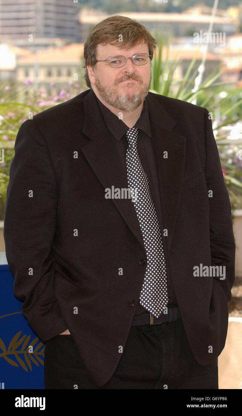 Author and film-maker Michael Moore poses for photographers during a ...
