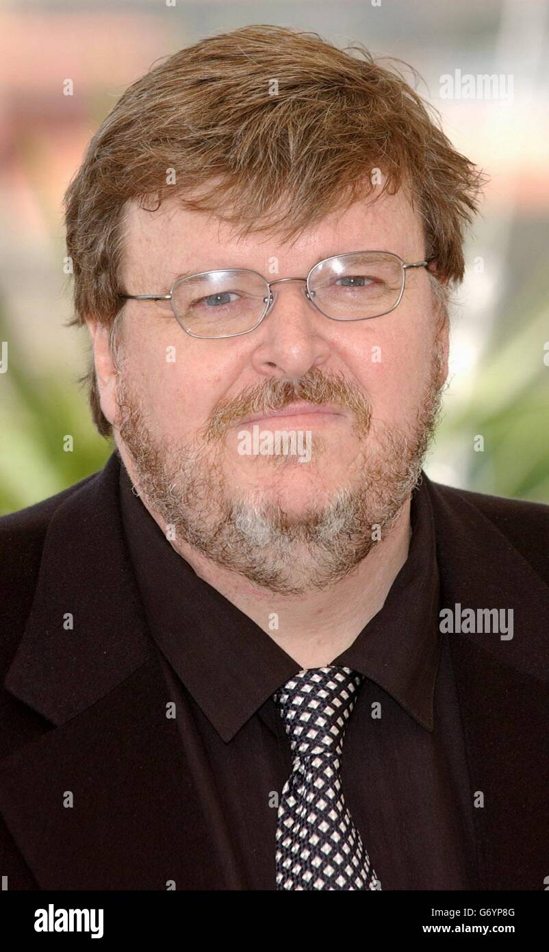 Author and film-maker Michael Moore poses for photographers during a ...