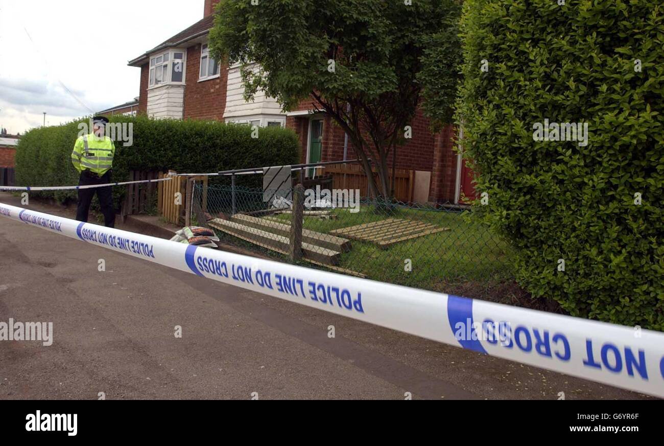 A policeman outside a house at Longacre Road after an West Midlands ...