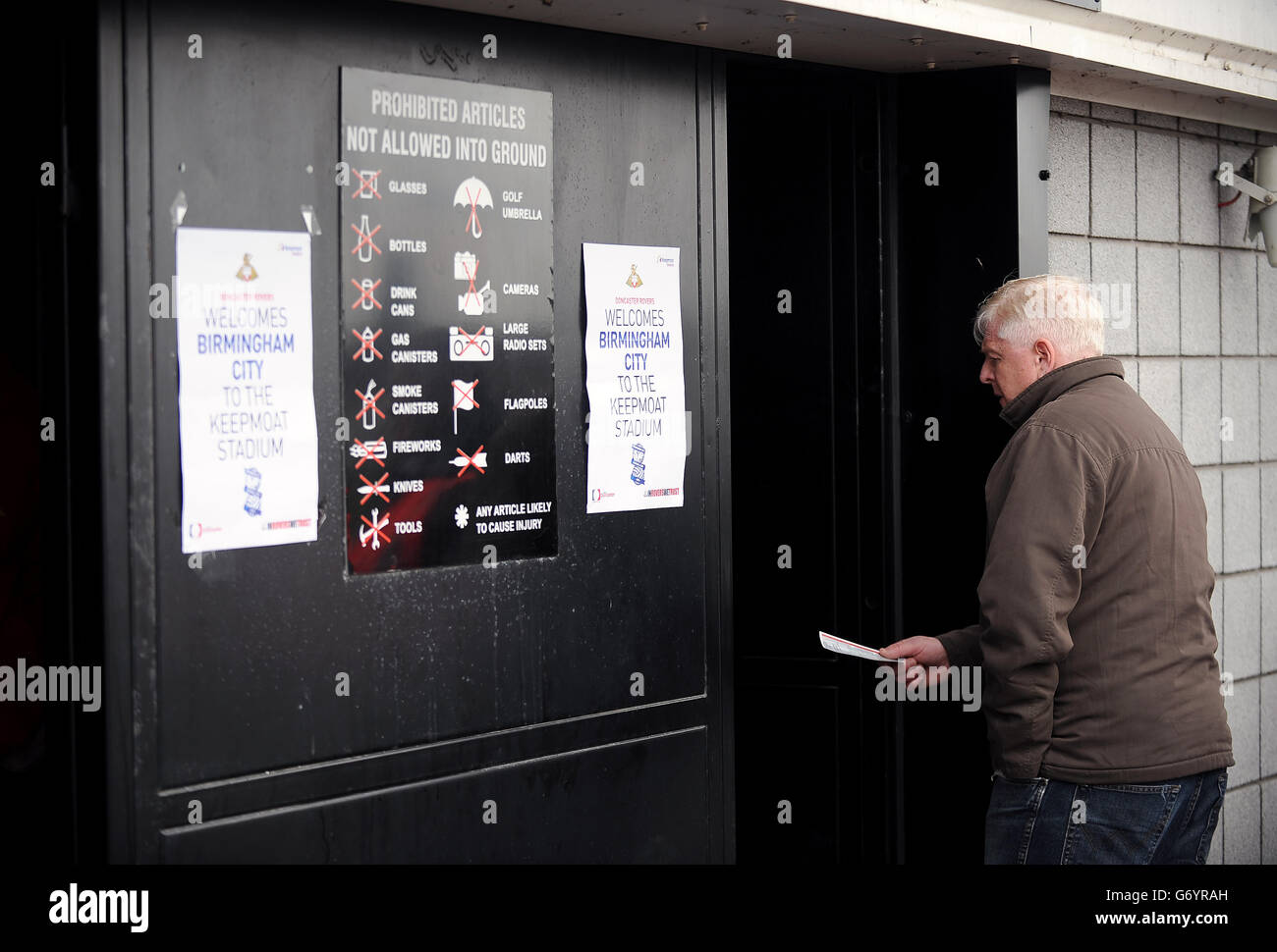 Fans head through the turnstiles at the Keepmoat Stadium Stock Photo ...