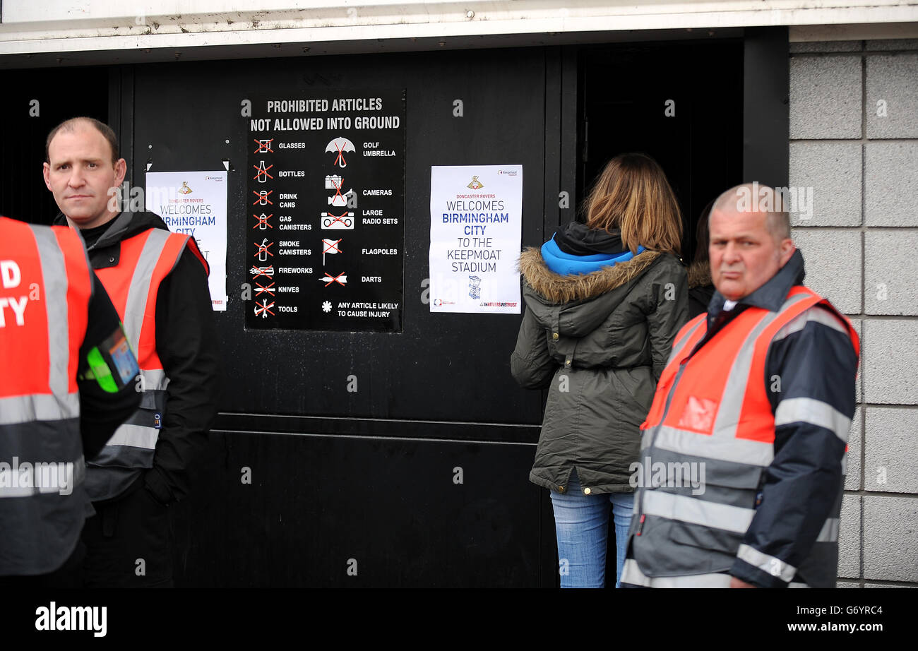 Fans head through the turnstiles at the Keepmoat Stadium Stock Photo ...
